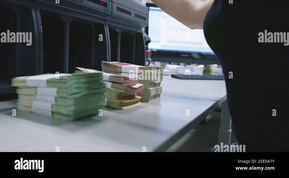 People, finance and cash concept - clerk hand counting dollars with ...