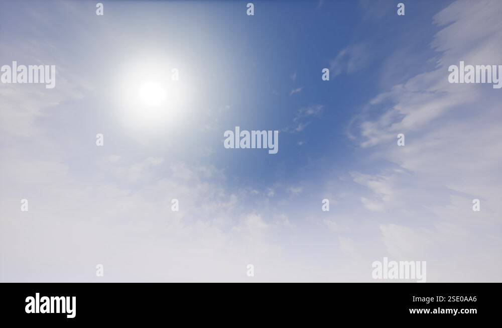 The high skies are covered with light clouds. The sun is blinding even ...