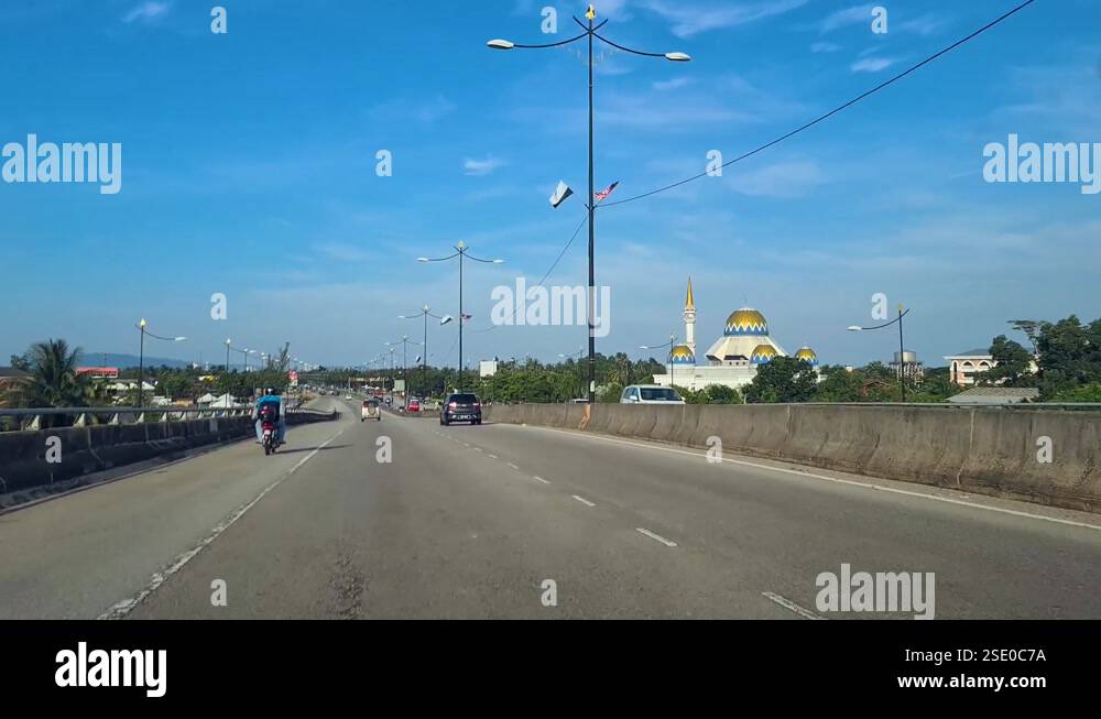 Driving Through Clear Roads Passing By A Gold And White Islamic Mosque ...