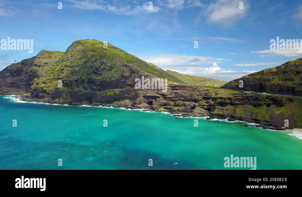 Zoom out drone shot from an island in Hawaii. Ocean on a cloudy day ...