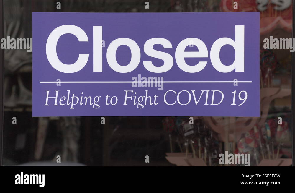 COVID 19 pandemic health safety signs on local businesses Stock Video ...