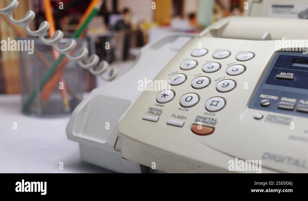 Man Dialing 911 On The Number Buttons On The Old Fax Telephone. A Man's ...