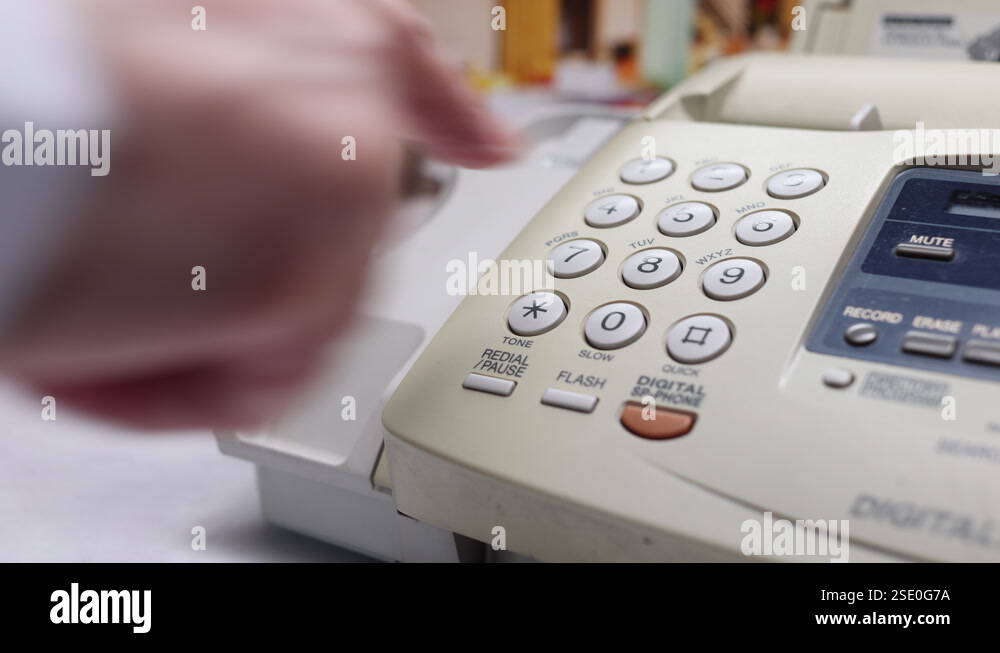 A Man's Hand Picks Up The Phone And Dials A Phone Number On The Dust ...