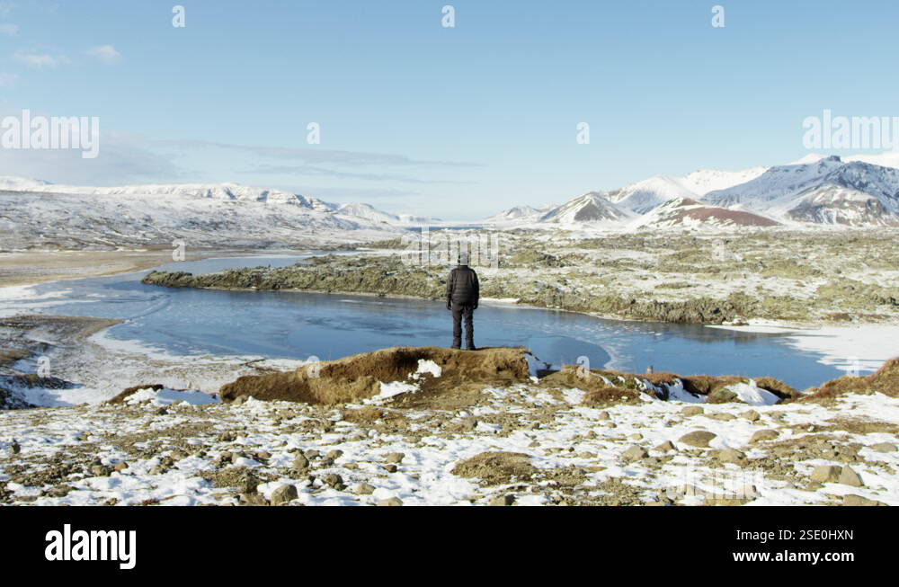 Adventurous Lone Tourist Overlooking Cold Icelandic Landscape Stock ...