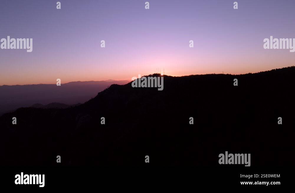 Sun rising in the distance atop of Mt Lemmon in Arizona Stock Video ...
