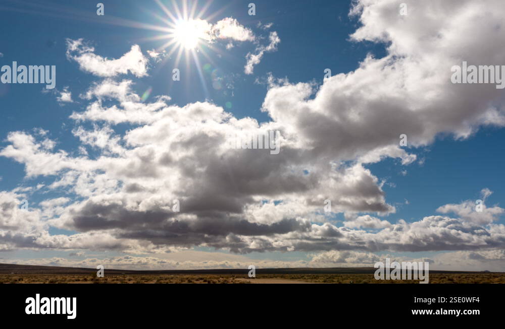 The sun shines through the overcast sky in this dramatic cloudscape ...