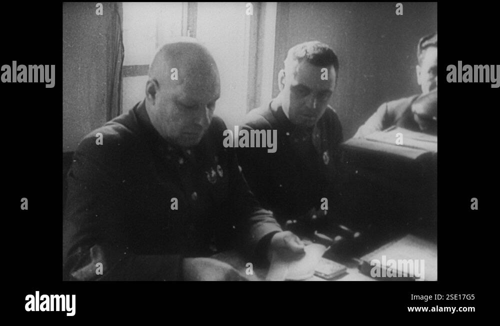 1940s: Soldiers hug on snowy field. Officers around table. Nazi officer ...