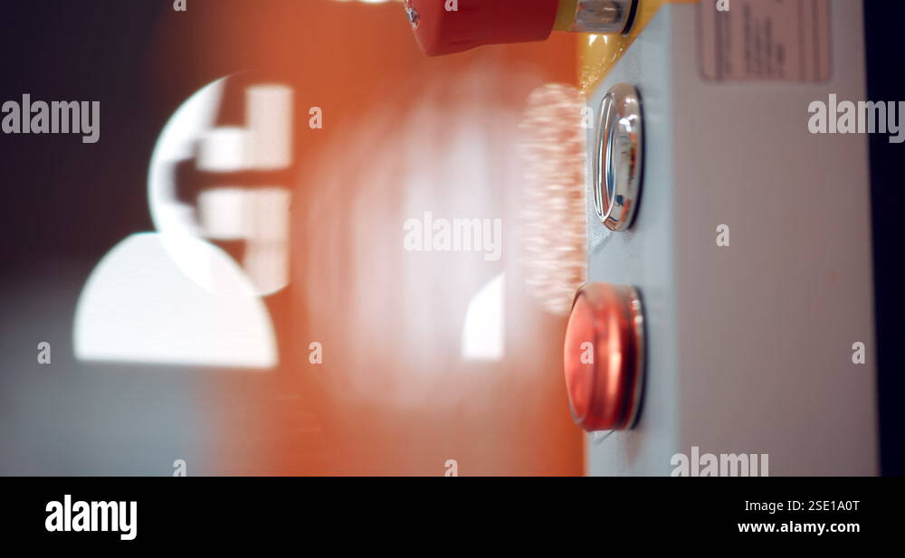 Large red industrial button, shiny chrome button and burning red light ...