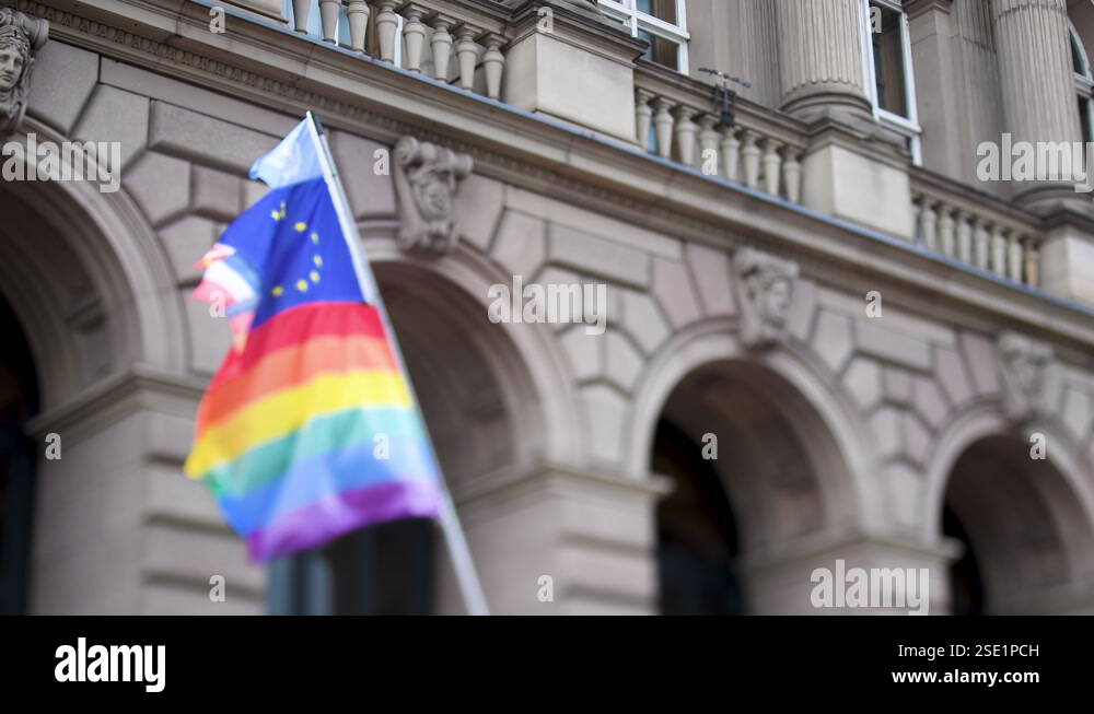 LGBT gay homosexual pride flags on one pole next to European Union and ...