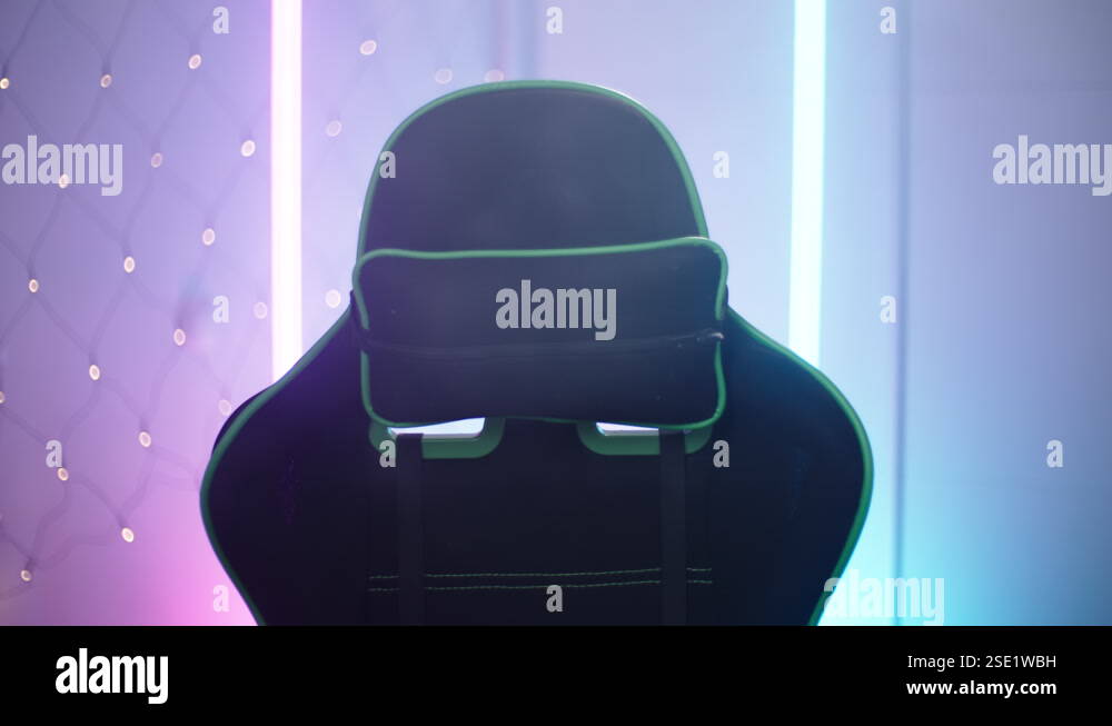 Empty gaming chair slightly moving in cyberspace room with haze ...