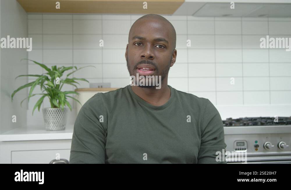 Middle Aged Man Listening Whilst Looking Directly into Webcam During ...