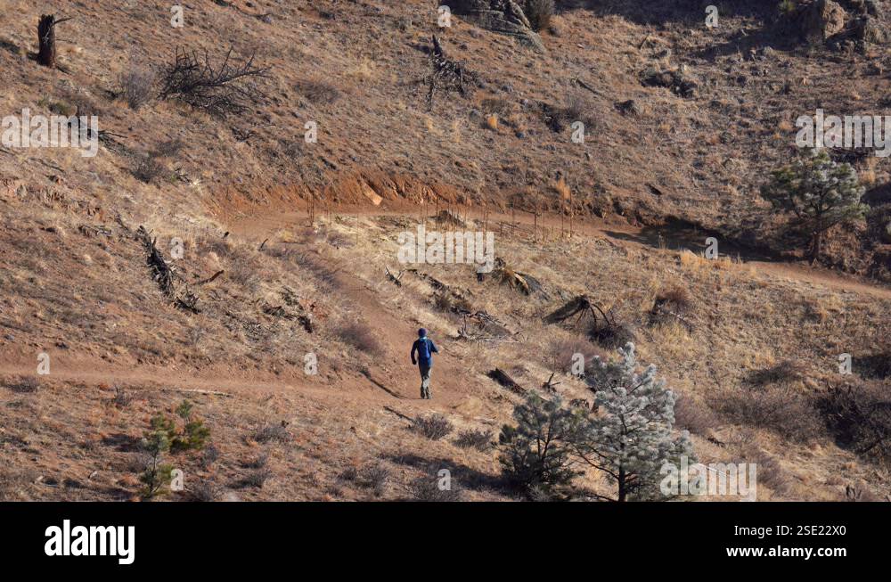 Person running in rugged trail in the Rocky Mountains Stock Video ...