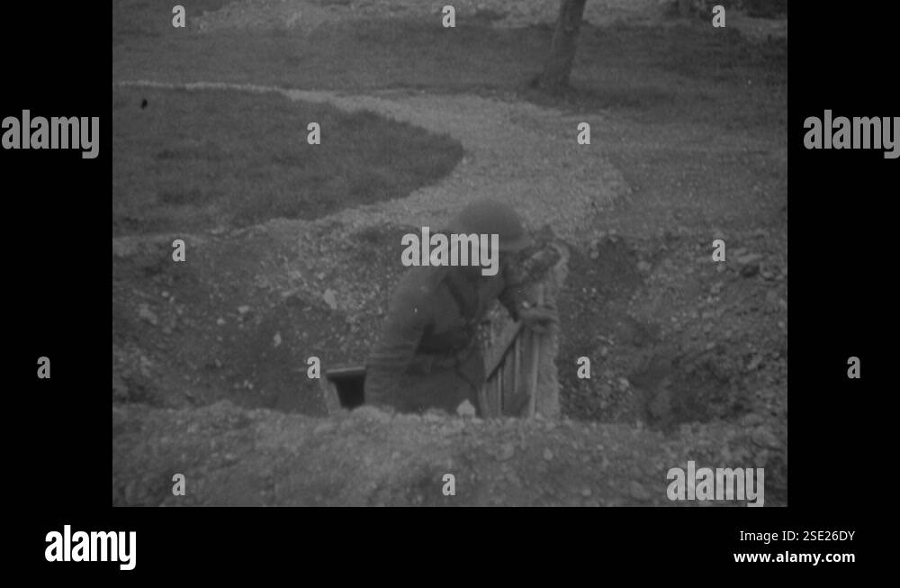 Europe 1910s: Text placard. Soldier emerges from concealed hole. Stone ...