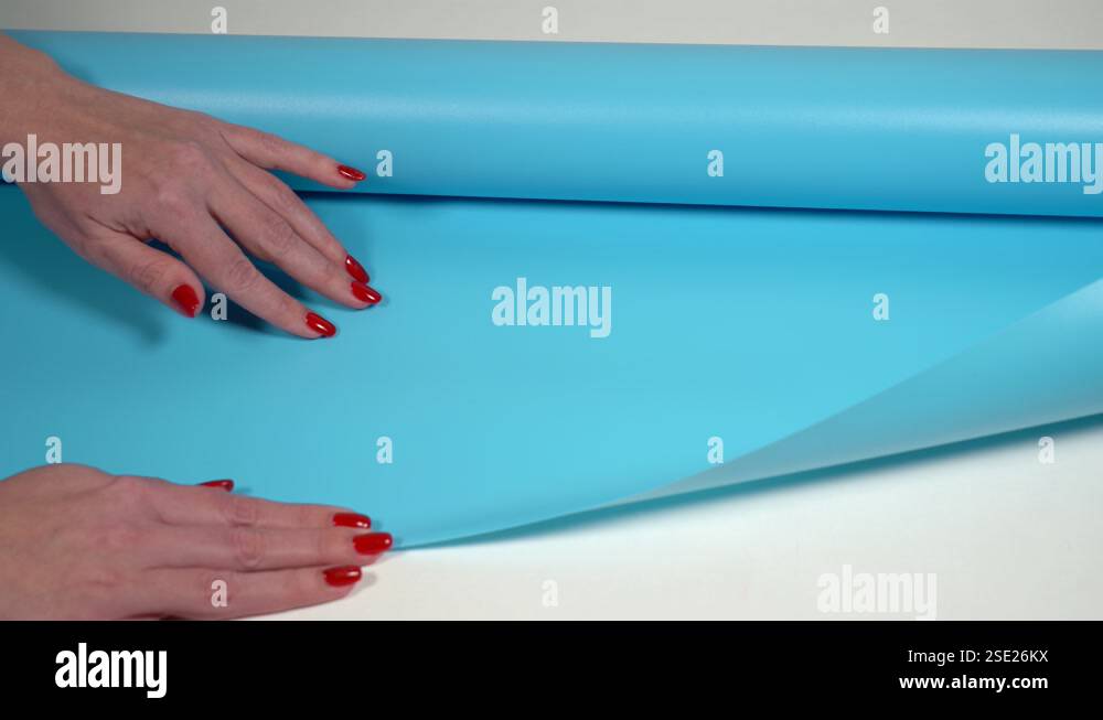 Photographer touching smooth texture of blue modern pvc photo ...