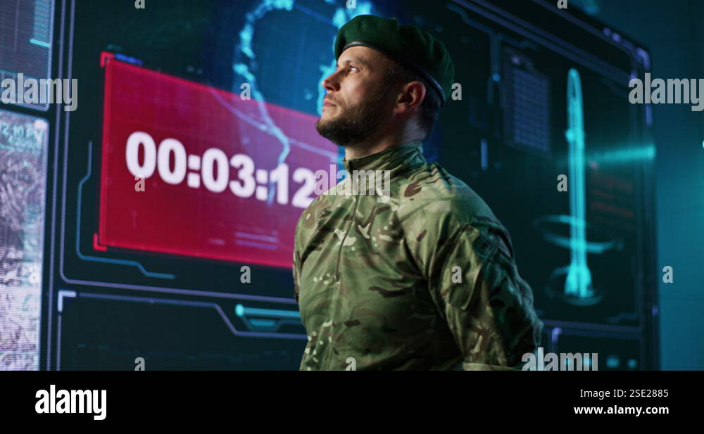 Male commander speaking with soldier in nuclear attack control center ...