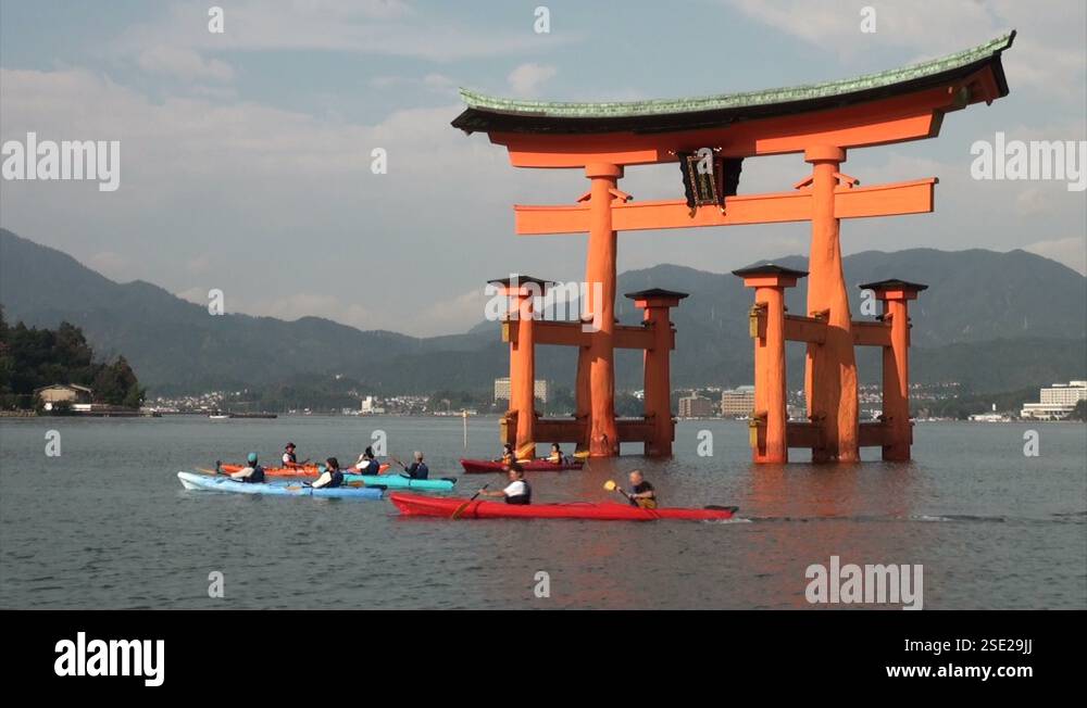 Canoes at the floating torii gate on Miyajima island, Japan Stock Video ...