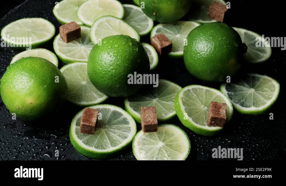 Lime slices closeup, macro background, fruits top view. Rotate. fresh ...