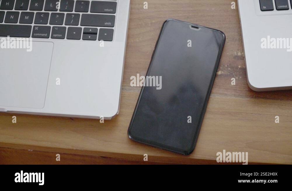 Smart phone place on table wood, Close-up the cell phone is on the ...