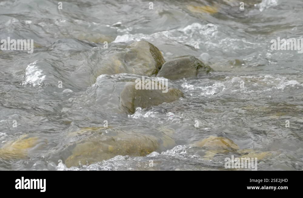 Foam waves on water surface. Stream of Sochi river flowing from ...