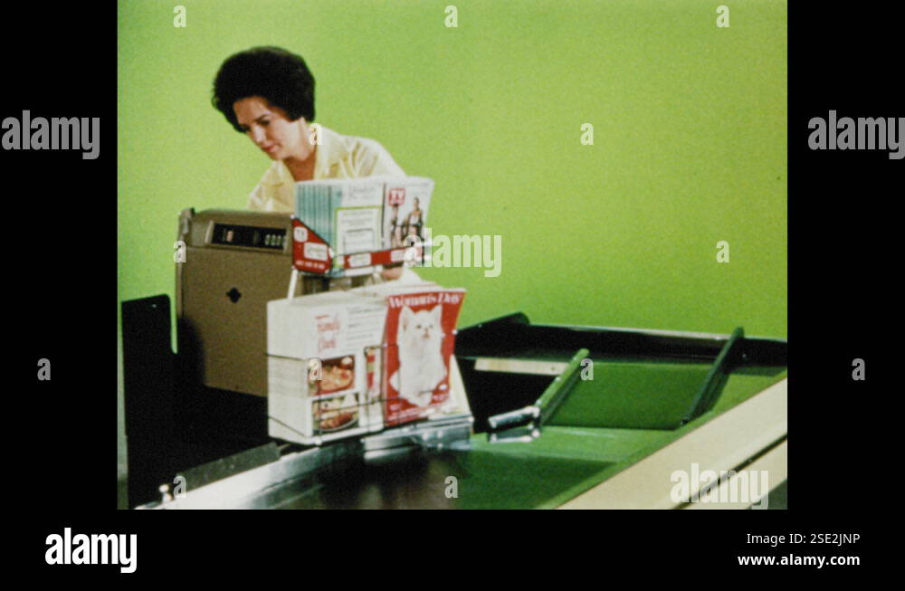 1960s: cashier counting money in cash register then closing that ...