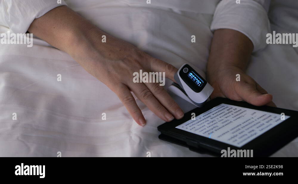 Pulse oximeter at home or clinic show blood oxygen saturation level and ...