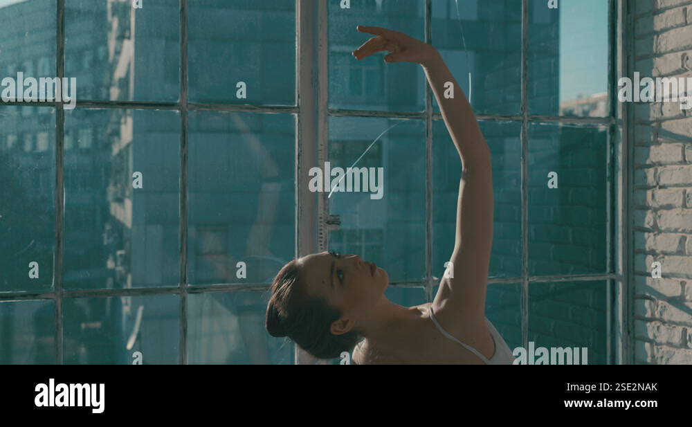 Talented young choreographer dancing ballet in white studio. Pretty ...