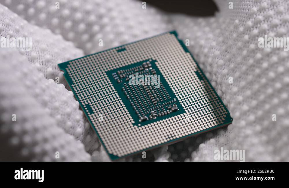 The processor is in the hands. A gloved hand holds the CPU Stock Video ...