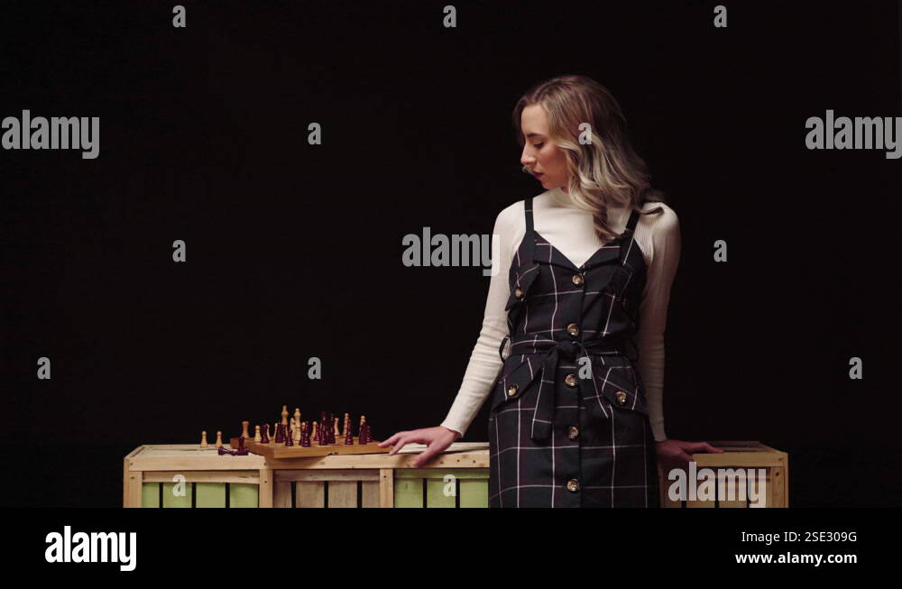Female Chess Player Making Strategic Move While Playing Alone. medium ...