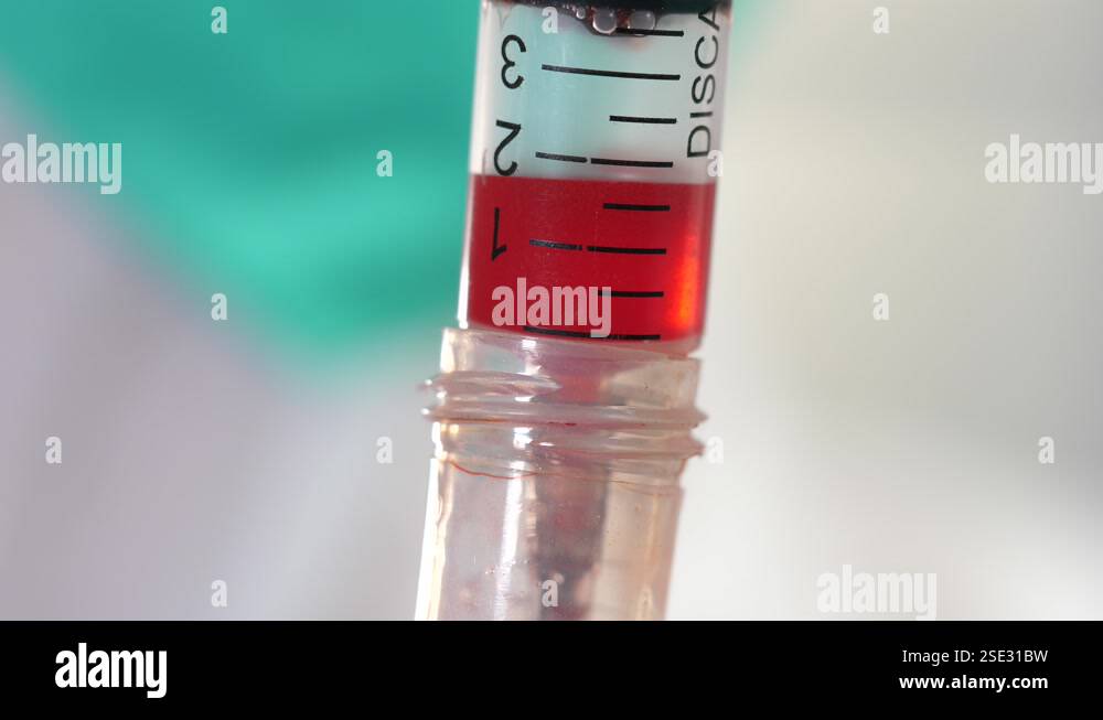 Syringe Taking a Blood Sample Closeup Stock Video Footage - Alamy