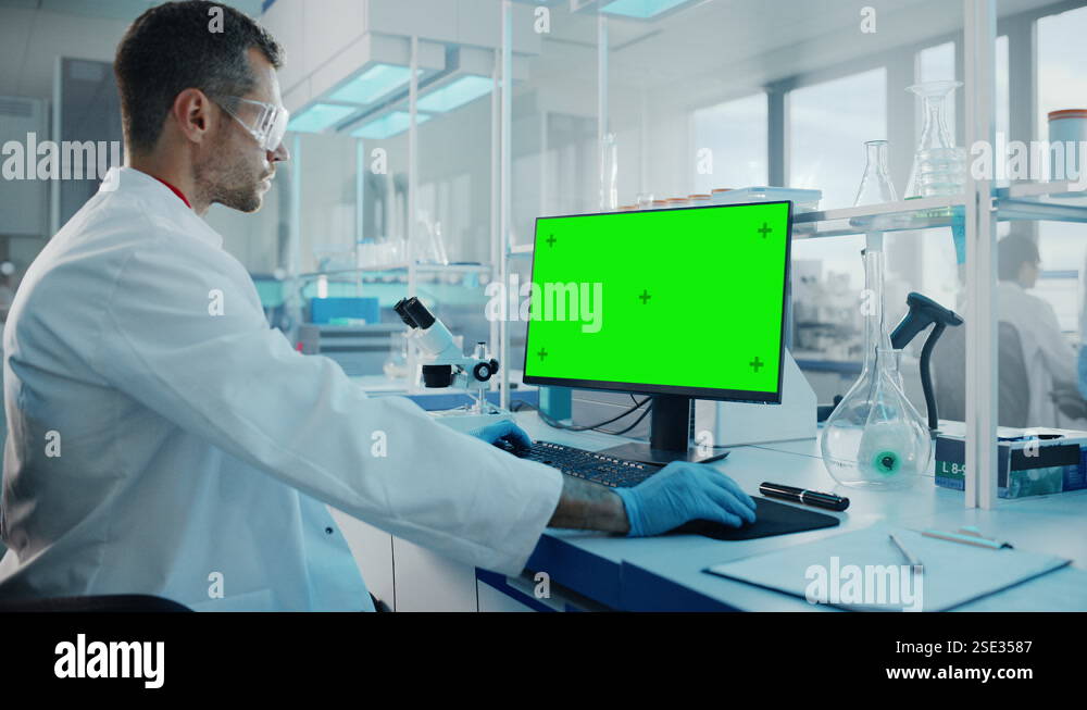 Medical Laboratory Scientist Working on Green Screen Computer Stock ...