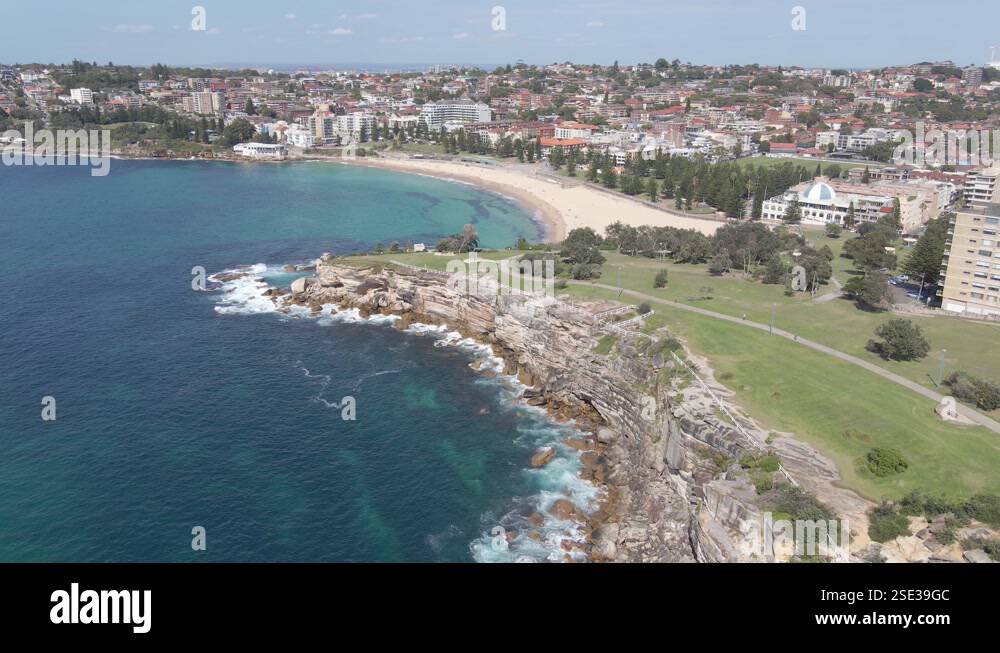 Ocean Waves Crashing At Dolphins Point Peninsula With Coogee Beach In ...