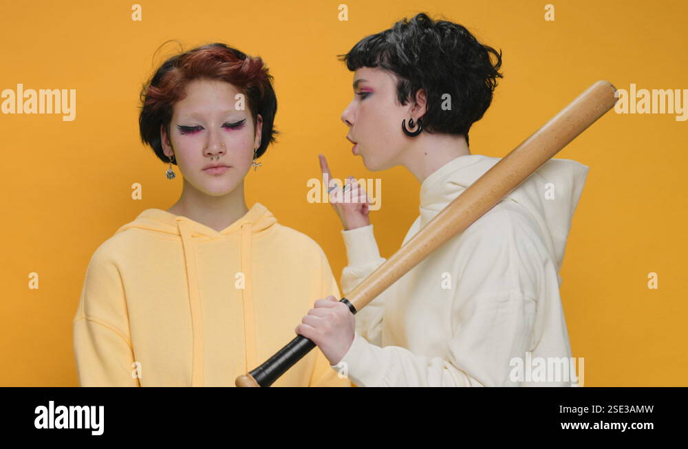 Teenage Girl Shouts Aggressively in Ear Girl with Baseball Bat on her ...