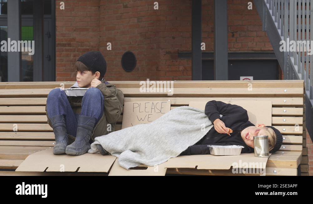 Homeless kids eating outdoors and looking away at strangers Stock Video ...