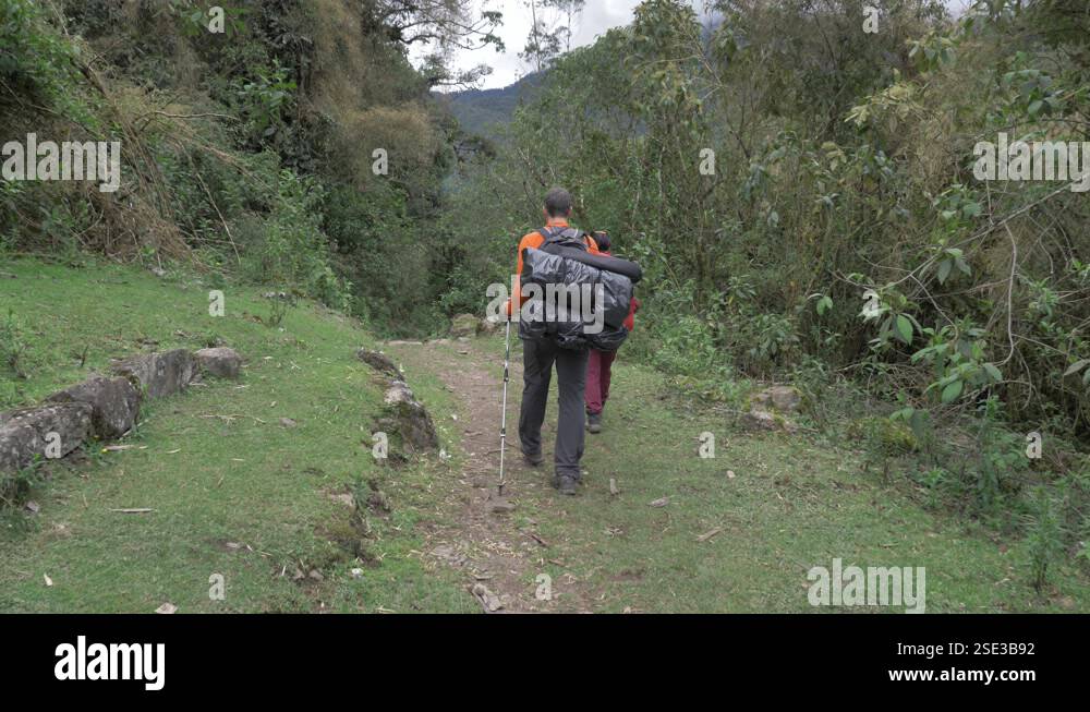 Couple making trekk in the forest, inca trail, road to vilcabamba, peru ...
