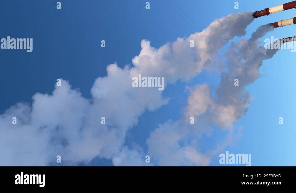 Steam from pipes of warmly electro station in a winter clear sunny ...