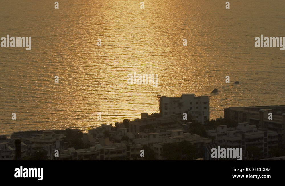 High Elevation View of Coastal Buildings with Backdrop of Golden Waves ...