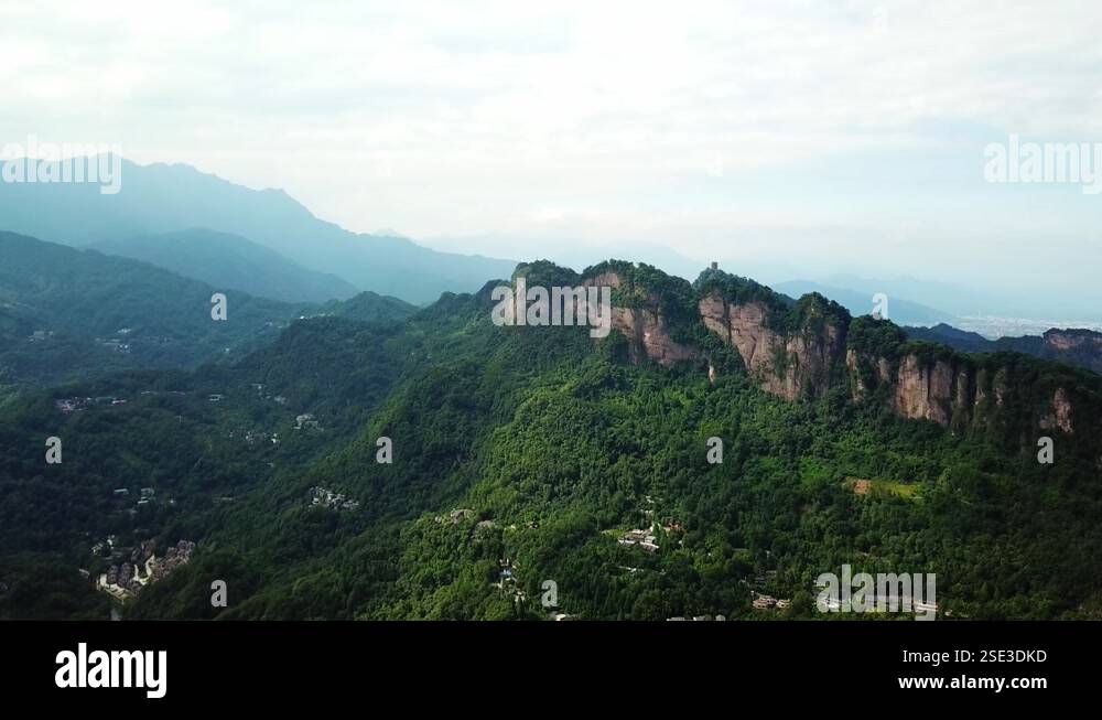 Aerial view of a peculiar mountain peak with houses on it in China ...