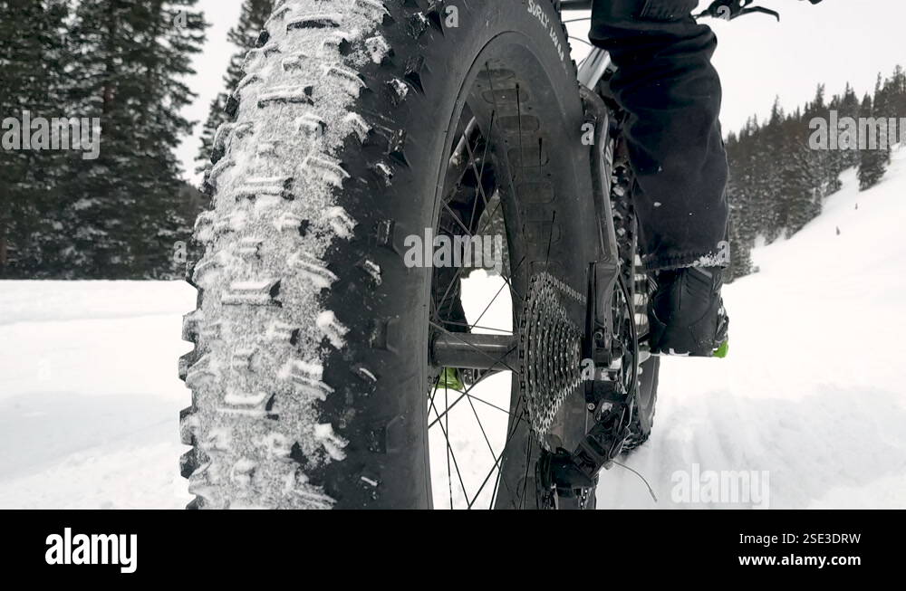 close up of a fat tire bike on the snow in the mountains Stock Video ...
