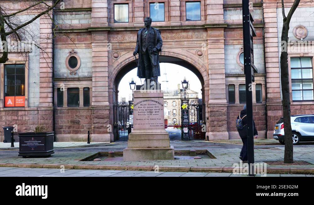 Man walks past the statue of General Gordon of Khartoum outside Robert ...