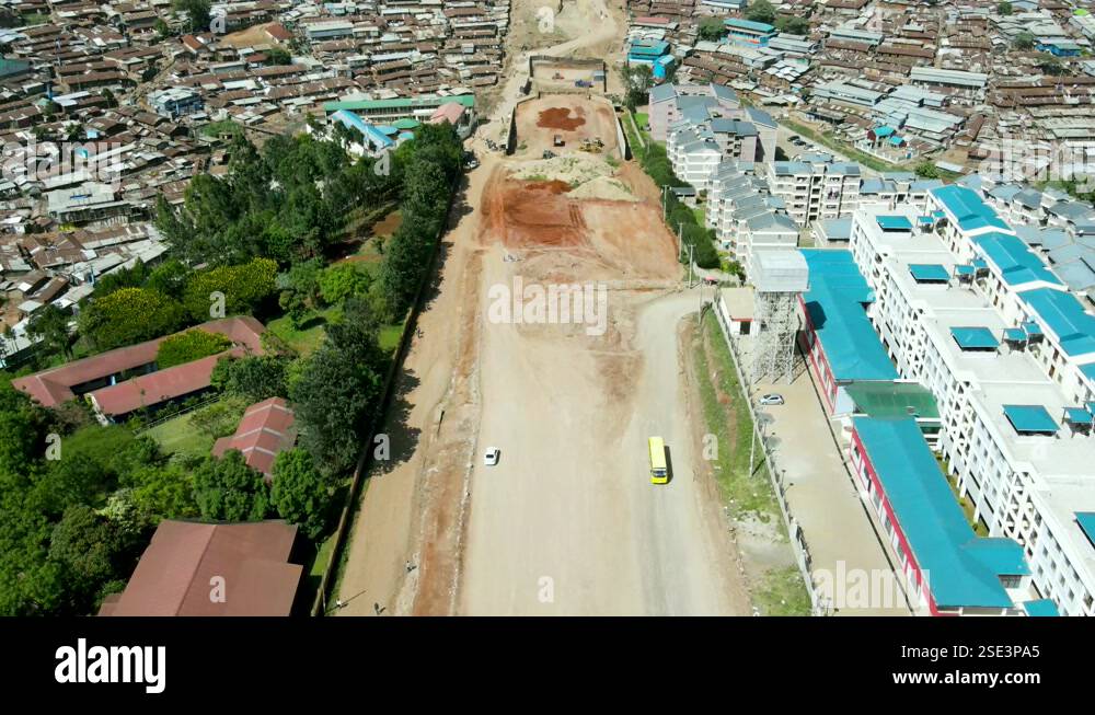 Poor Slums district with old rubble stony road and modern capital city ...