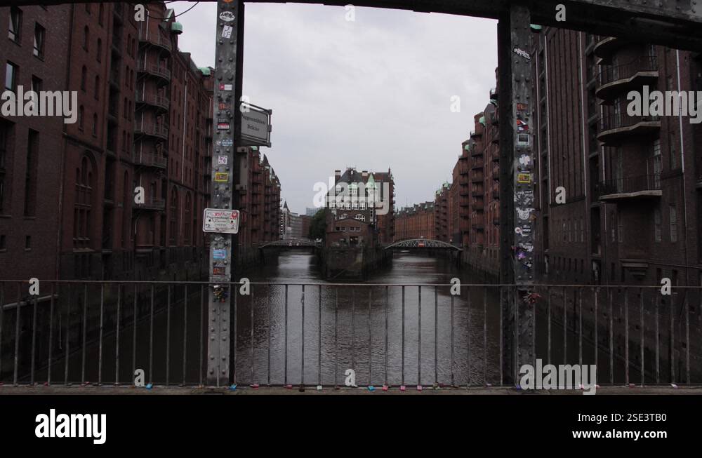 Wide shot of red buildings and warehouses, bridges and water canals in ...