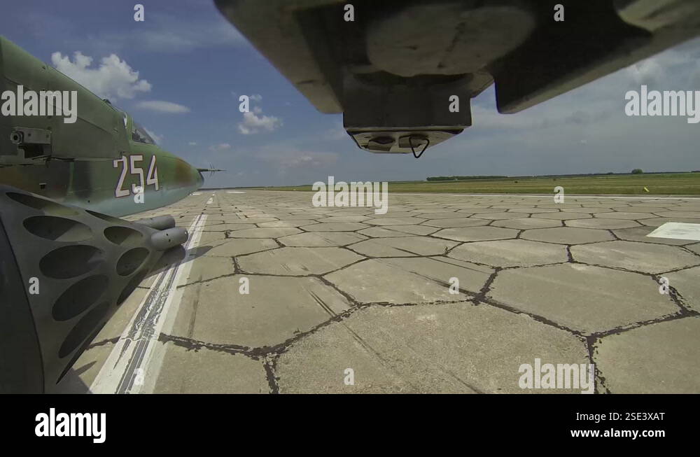 Combat aircraft taxiing on the runway from under the right wing point ...