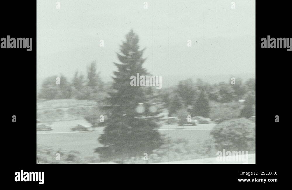 1940s: Landscape of houses, buildings, trees. State of Utah written on ...