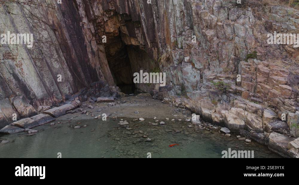 Sea cave with koi fish in Hong Kong Geopark Stock Video Footage - Alamy