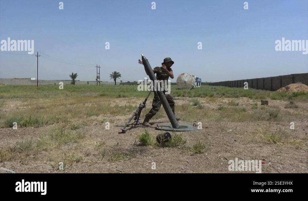 Iraqi soldier firing a mortar shell at ISIL targets at Fallujah ...
