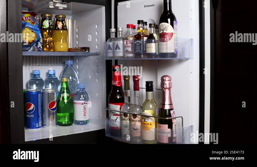mini bar with soft drinks, vodka, wine in the hotel room Stock Video ...