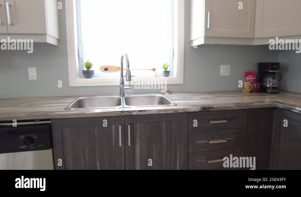 modern kitchen gimbal zoom into show stainless sink real estate Stock ...