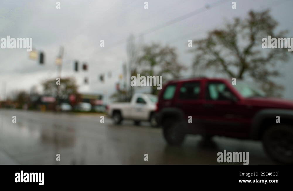 Intentional blur, cars turn street corner intersection with turn ...