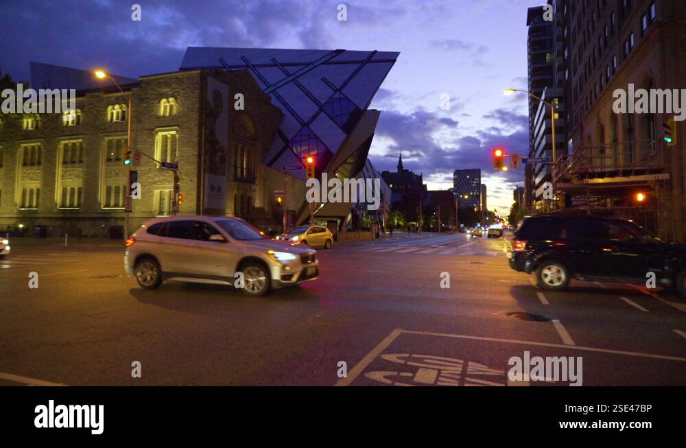Traffic passes through an intersection, outside the Royal Ontario ...