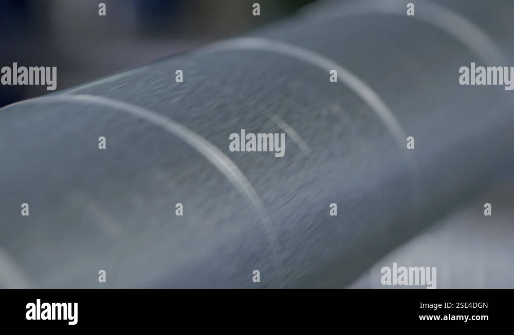 A metal-wrapped cable moving along a conveyor belt. Cable Production ...